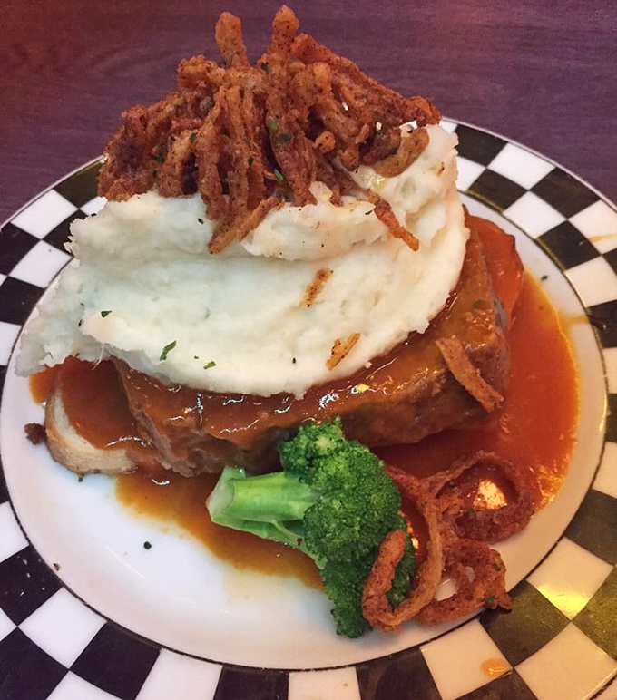 Behold the legendary meatloaf &ndash; a towering monument to comfort food that makes grandma's version seem like amateur hour.