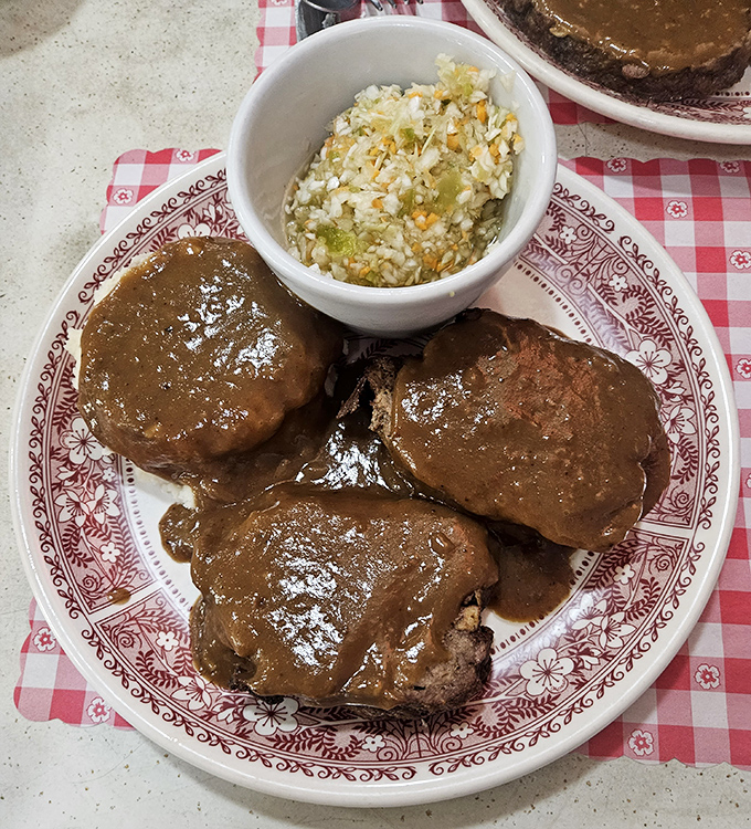 Meatloaf that doesn't just sit on the plate&mdash;it commands respect. Glistening with gravy and served with homestyle coleslaw that grandma would approve.
