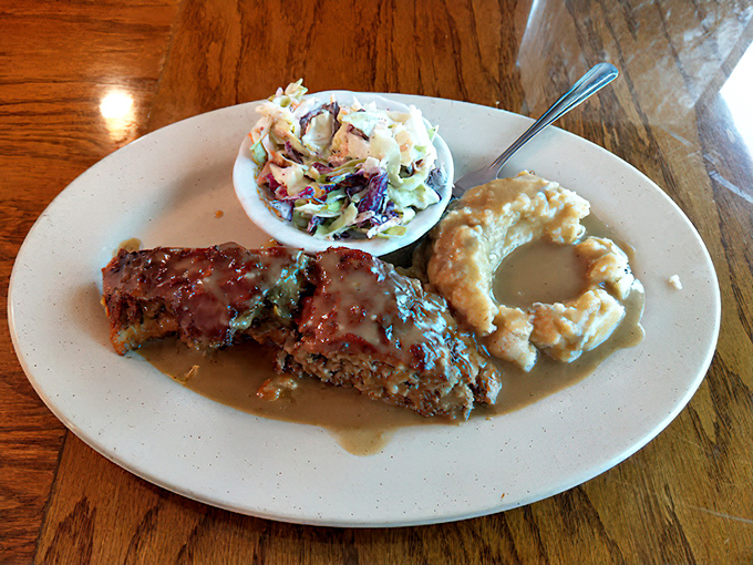 Behold the star attraction: Leo's meatloaf swimming in rich gravy alongside creamy coleslaw and mac and cheese. Grandma would approve&mdash;and be jealous.