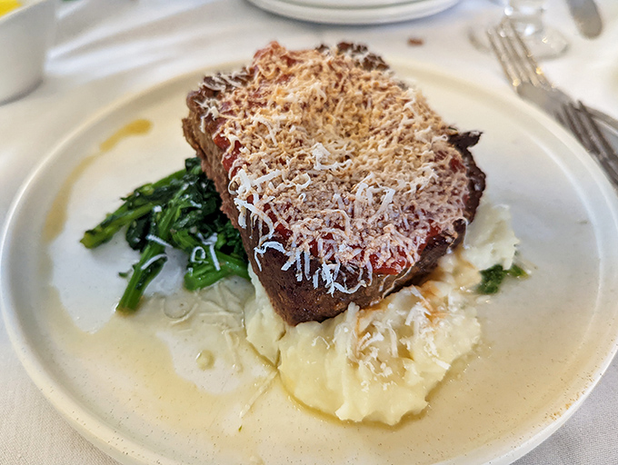 The star of our show: meatloaf that would make your grandmother simultaneously proud and jealous, nestled on a cloud of mashed potatoes.