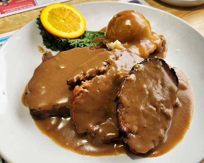 Meatloaf that would make your grandmother both proud and jealous. That gravy doesn't just cover the meat—it's practically tucking it in for a flavor nap.