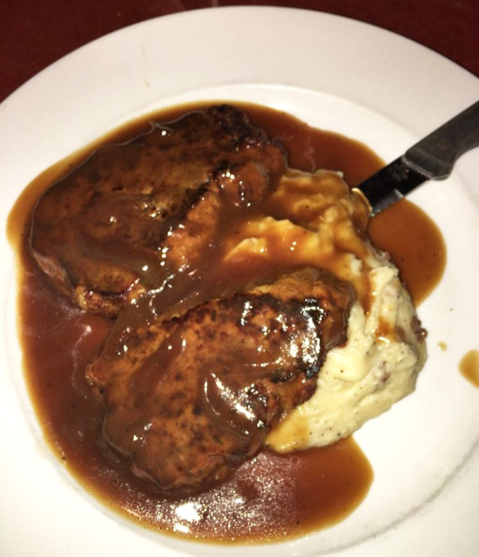 Meatloaf swimming in rich gravy alongside cloud-like mashed potatoes&mdash;comfort food that doesn't just hug your soul, it gives it a warm blanket.