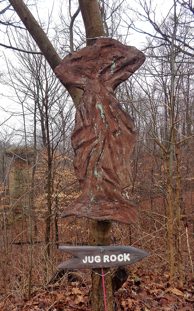 Folk art meets forest whimsy! This handcrafted wooden Jug Rock replica serves as a charming trail marker, proving even famous rocks need their own merchandise.