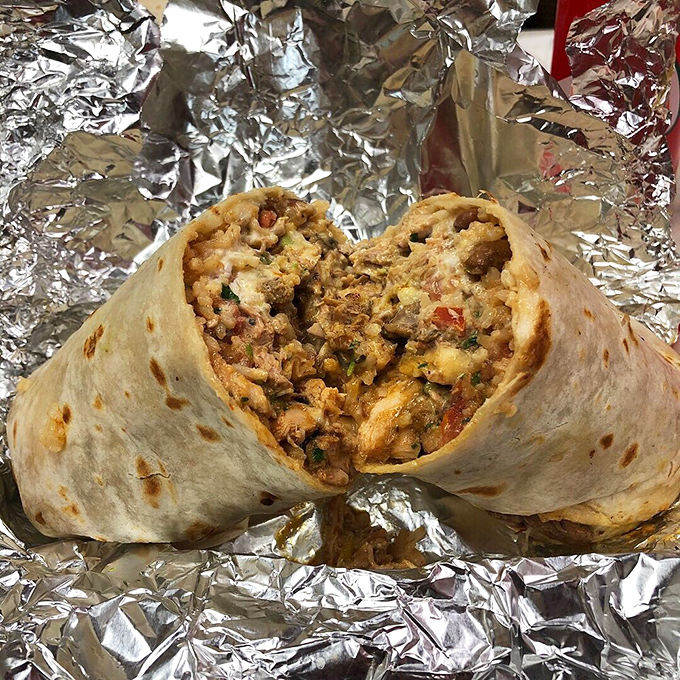 Behold the cross-section of burrito perfection &ndash; where rice, beans, meat, and cheese achieve a harmony that would make a symphony conductor weep.
