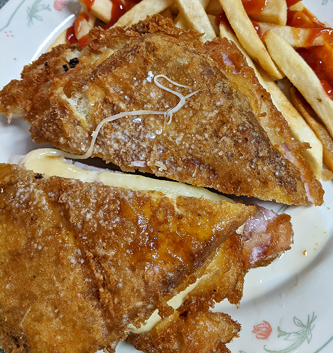 Golden-brown perfection that makes you want to high-five the chef. This Monte Cristo sandwich is what happens when French toast and ham decide to elope.