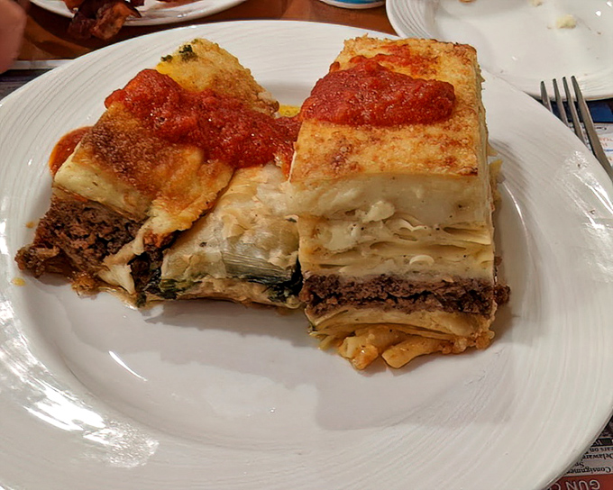 This isn't just pasta&mdash;it's a layered masterpiece of comfort. The moussaka arrives steaming hot with a golden top that gives way to savory treasures below.