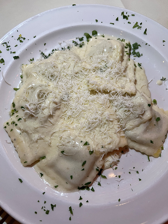 Ravioli so creamy it should come with a warning label. This isn't just pasta—it's a pillowy vessel for pure comfort.