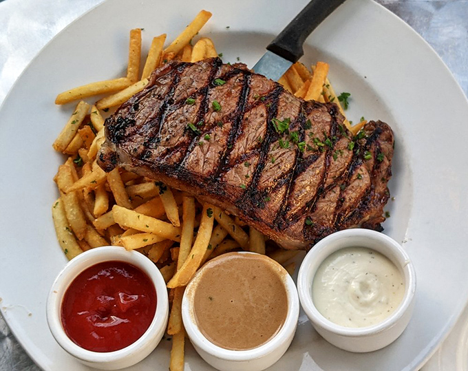 A steak that's dressed better than most people at a wedding. Those three dipping sauces aren't just accessories—they're essential supporting characters.