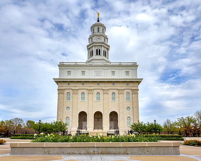 The Nauvoo Temple stands majestically against the Illinois sky, its limestone exterior glowing like nature's spotlight on this architectural masterpiece.