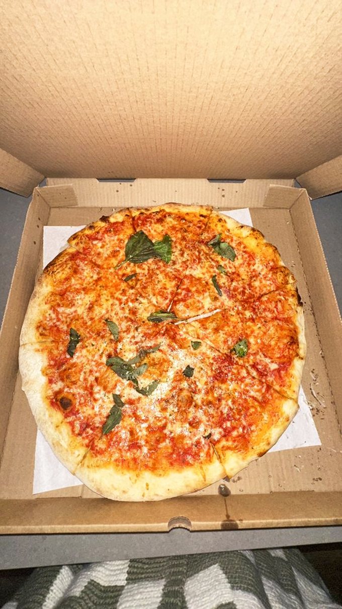 The classic margherita with fresh basil&mdash;pizza in its purest form. That crust has the perfect char that whispers, "I was made by someone who cares." 
