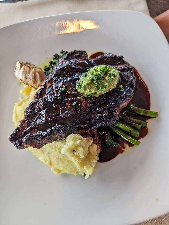 A perfectly seared steak with a dollop of herb butter that's practically begging you to cancel all afternoon appointments.