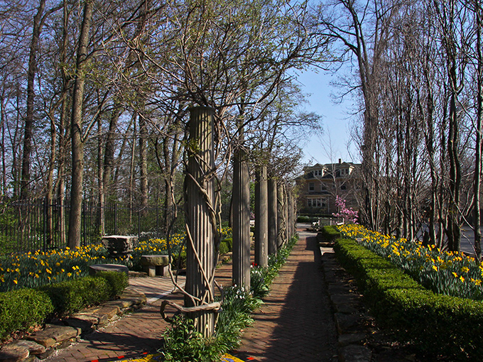 Oakhurst Gardens' colonnade walkway feels like stepping into a secret passage from a Jane Austen novel, except with better cell reception.