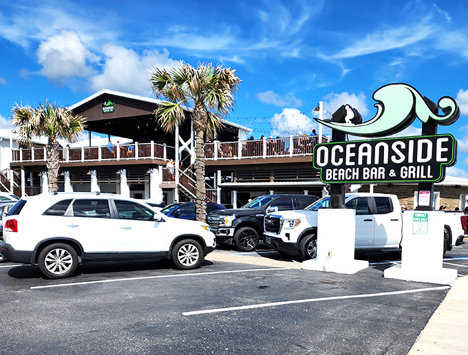 Oceanside's multi-level deck practically screams "sunset cocktails here!" The wave-inspired sign is your invitation to coastal cuisine with a side of sea breeze.