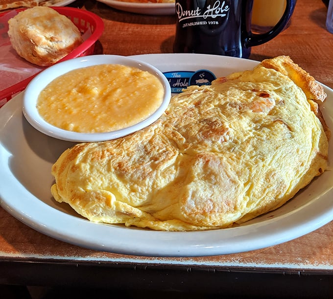 Behold, the omelet in its natural habitat&mdash;perfectly folded, gloriously golden, and ready to make your morning memorable. Grits on standby.