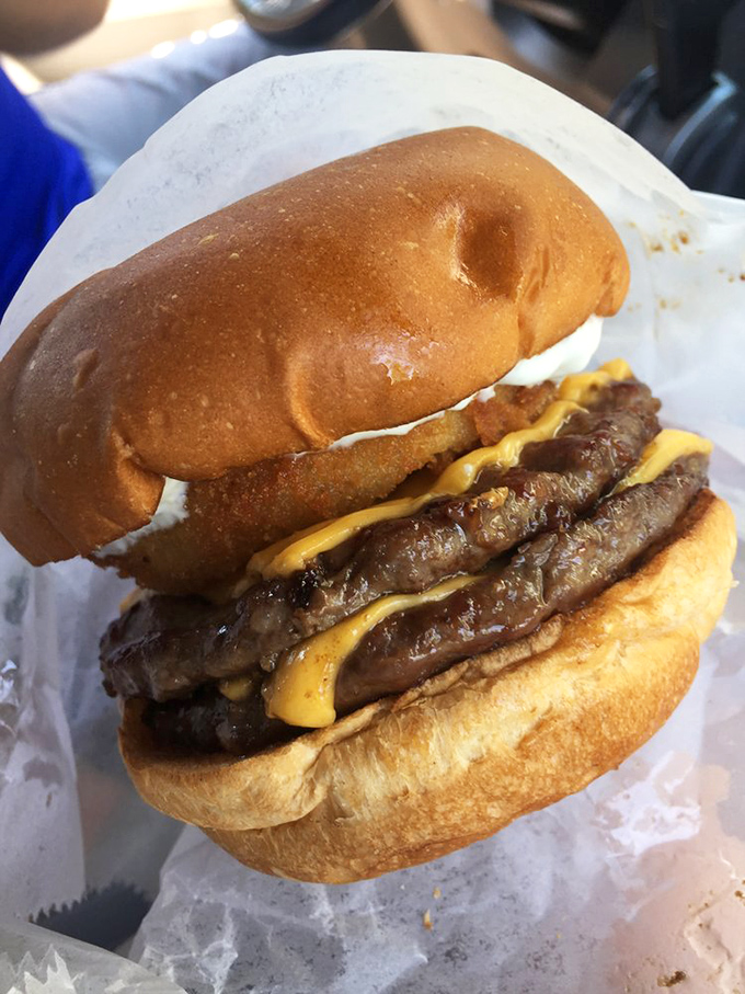 Behold the double-decker masterpiece &ndash; where juicy patties and melty cheese create the kind of burger that requires both hands and several napkins.