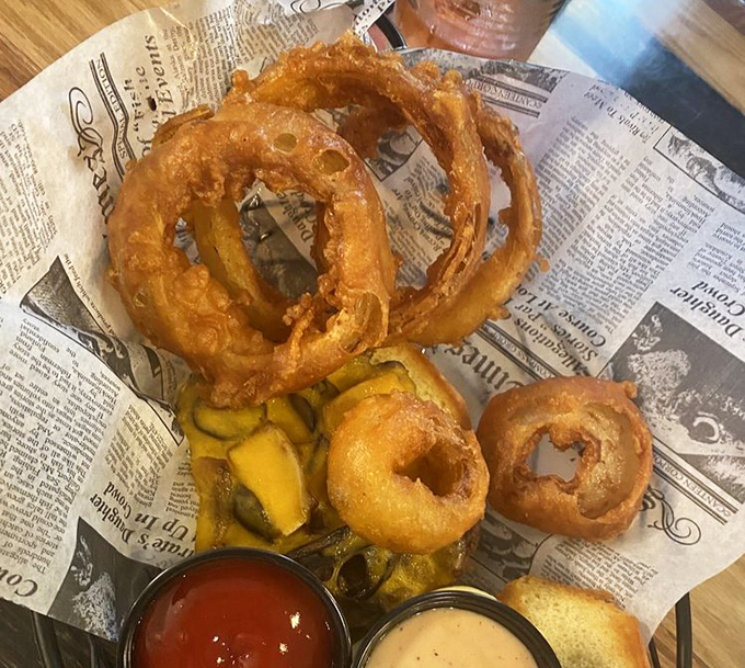 Golden halos of happiness served on newspaper&mdash;these aren't just onion rings, they're edible jewelry that somehow improves your day with each crunchy bite. 