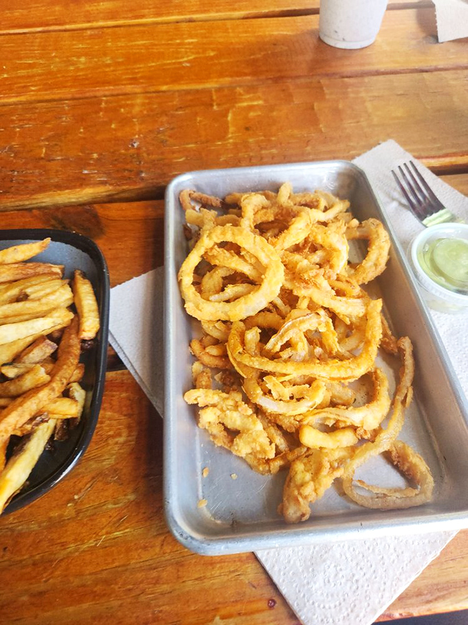 These aren't just onion strings—they're golden halos of happiness. Crispy, delicate, and addictive enough to make you forget your table manners.