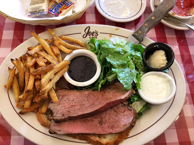 The Open Face Tri-Tip sandwich doesn't need to hide between bread—it proudly displays its perfectly pink interior like a carnivore's version of showing off vacation photos.