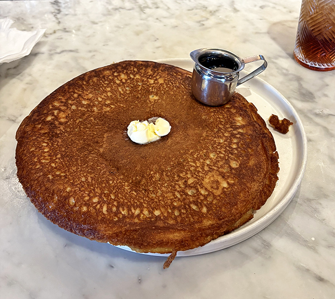 Behold the pancake in its natural habitat&mdash;golden-brown perfection that's practically auditioning for the breakfast hall of fame.