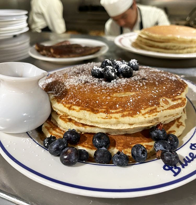 Pancake perfection isn't just about height&mdash;it's about that golden exterior giving way to cloud-like interior. These blueberry-studded beauties are breakfast nirvana.