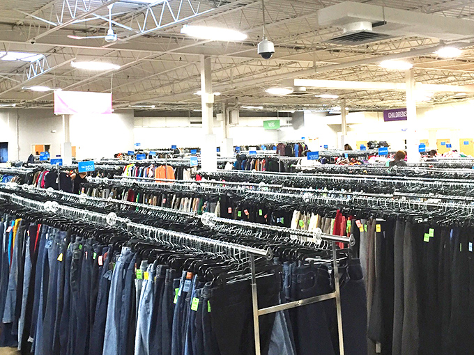 Row after row of pants await new legs to fill them. In this denim democracy, designer labels mingle with everyday workwear.