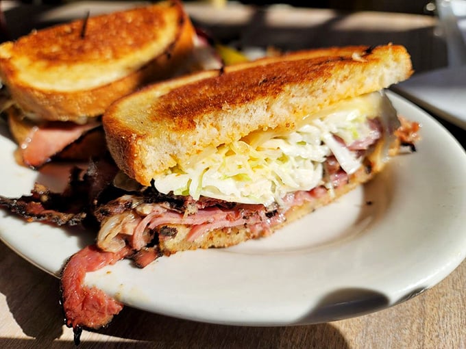 Behold the sandwich that launches a thousand road trips&mdash;perfectly grilled bread embracing a mountain of meat with just enough slaw for that essential crunch.