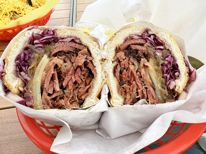 Behold the star of the show! This pastrami sandwich isn't just lunch—it's a masterclass in meat, with each pink ribbon of flavor nestled between fresh bread.