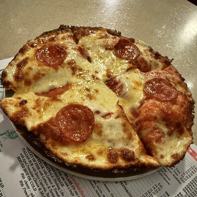 Pizza perfection doesn't need fancy words. That crispy-edged crust, bubbling cheese, and perfectly curled pepperoni tell you everything you need to know.