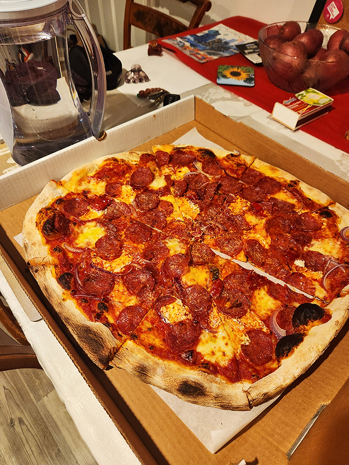 Those curled-up pepperoni cups are little flavor jacuzzis, collecting pools of delicious oil that will make you forget every chain pizza you've ever eaten.