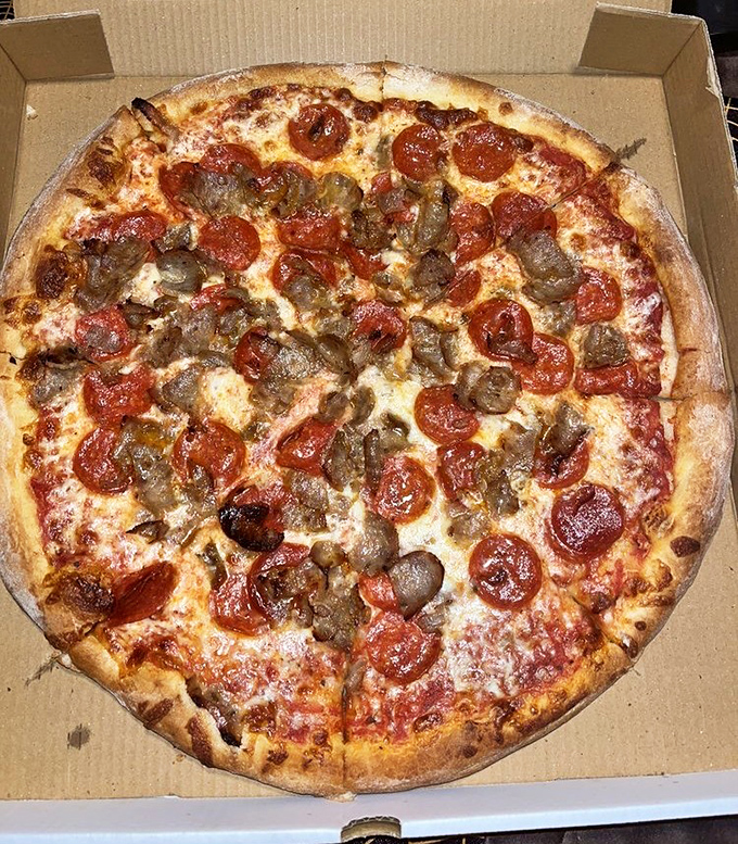 Pizza perfection doesn't need fancy toppings&mdash;just perfectly curled pepperoni cups and savory sausage on a canvas of melted cheese. This is edible art, DelCo style.