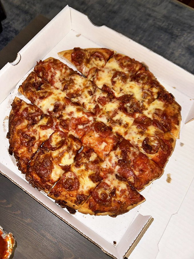 Pepperoni that curls into perfect little flavor cups, cheese that stretches for days. This pizza doesn't need a filter—it's the real-deal photogenic food that tastes even better than it looks.