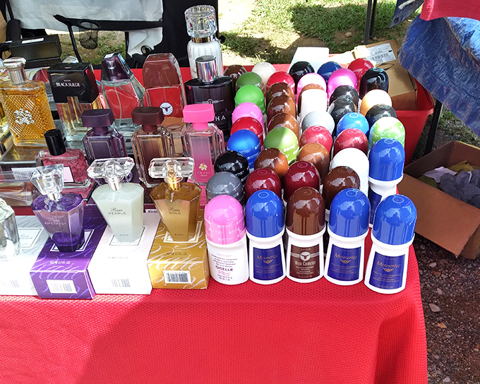 Fragrance heaven for the savvy shopper! This colorful array of perfumes and deodorants proves one person's decluttering is another's scented treasure hunt.