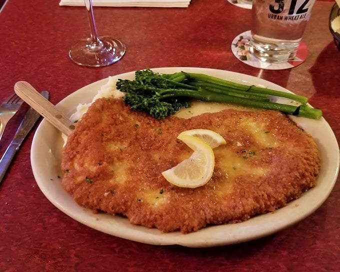This isn't just breaded pork&mdash;it's the Perkinsville Pork that locals whisper about. Golden-crisp exterior giving way to tender meat, with broccolini standing at attention.