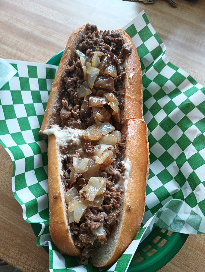 Behold the holy trinity of Philadelphia cuisine: thinly sliced beef, perfectly caramelized onions, and cheese melted into every nook and cranny. It&rsquo;s the iconic Philly cheesesteak&mdash;pure poetry on a roll.