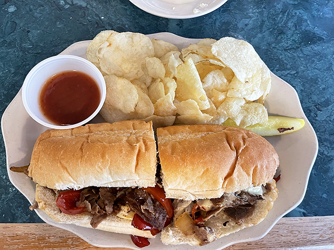 This Philly cheesesteak isn't trying to win beauty contests, but the tender meat, melted cheese, and fresh roll create a sandwich symphony worth the drive.