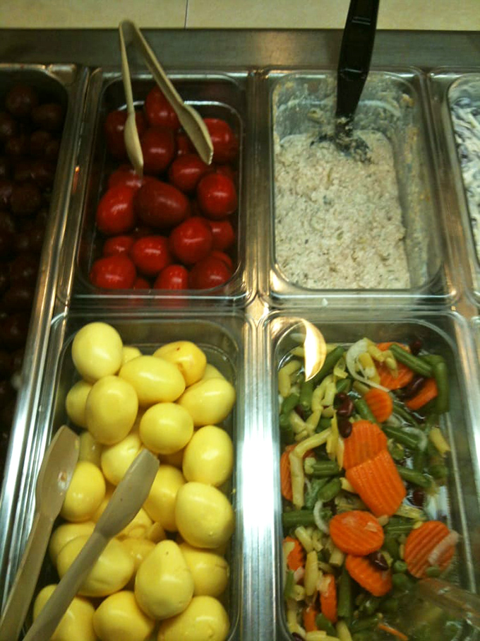 The salad bar's colorful array features pickled eggs and fresh vegetables. Simple ingredients transformed by tradition&mdash;the Amish way of turning ordinary into extraordinary.