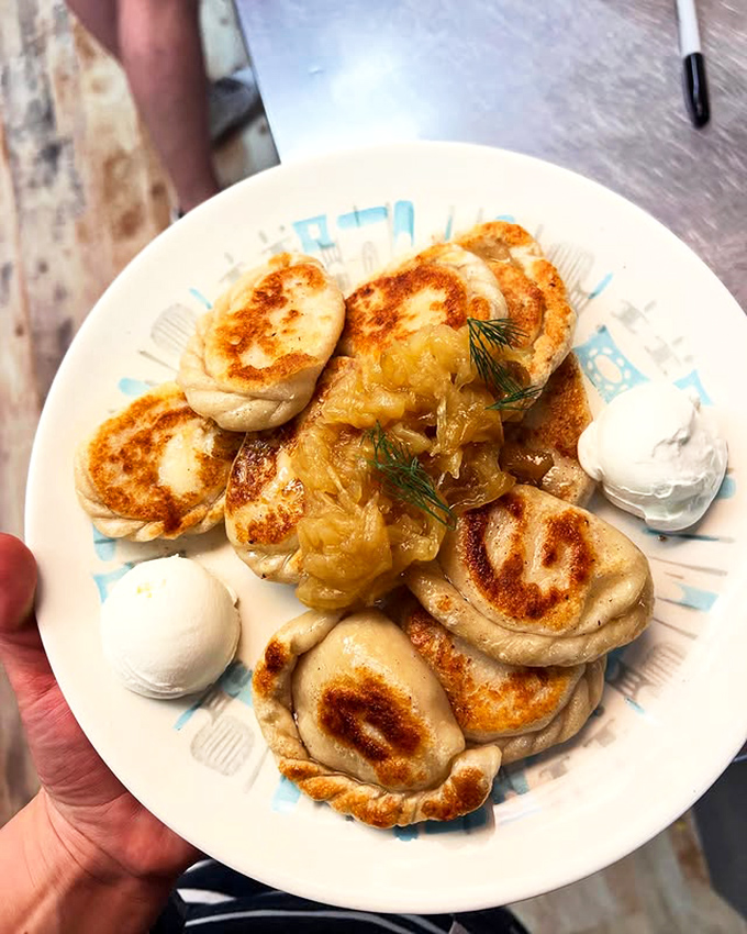 Golden-brown pockets of joy, these pan-fried pierogies with caramelized onions and sour cream are what dreams&mdash;and stretchy pants&mdash;were made for.