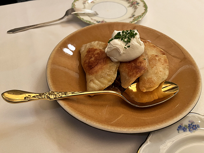Golden-brown pierogies that would make your grandmother weep with joy. These pillowy pockets of potato perfection, topped with a dollop of sour cream, are worth crossing state lines for.
