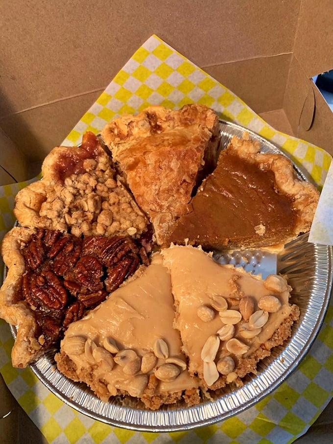 Pie paradise found! This sampler plate showcases the holy quartet of pecan, apple, pumpkin, and peanut butter&mdash;proof that sharing is both caring and strategic.
