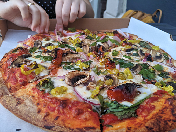 This veggie-loaded masterpiece isn't just pizza&mdash;it's a garden party where every ingredient gets to shine under a perfect blanket of melted cheese.