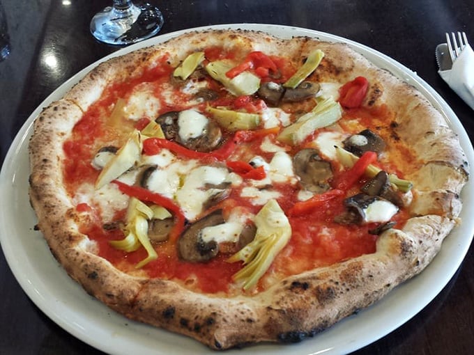 This isn't just pizza; it's edible art. The perfect char marks are like nature's signature saying, "You're welcome for this moment of bliss."