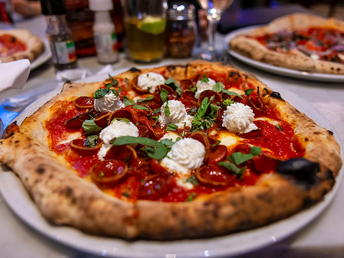 Pizza perfection isn't just about taste&mdash;it's visual poetry. Those dollops of fresh cheese and that perfectly charred crust speak fluent Italian.
