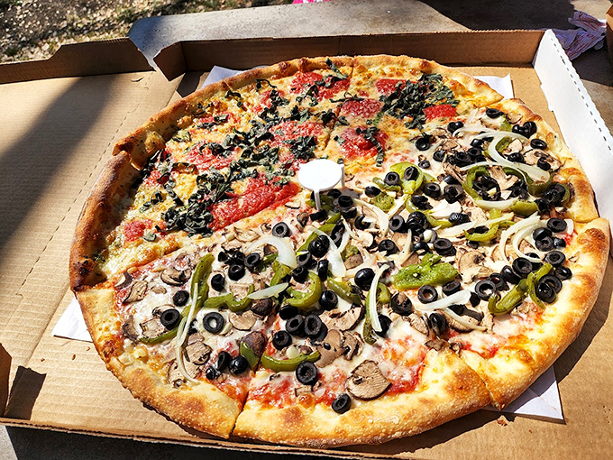 Pizza perfection doesn't need fancy words&mdash;just look at those toppings! The kind of pie that makes conversation stop and eyes close in appreciation.