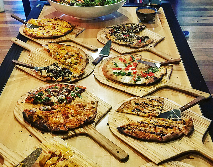 Pizza paradise on wooden paddles&mdash;each one a different journey through flavor country, with crusts that deserve their own fan club.