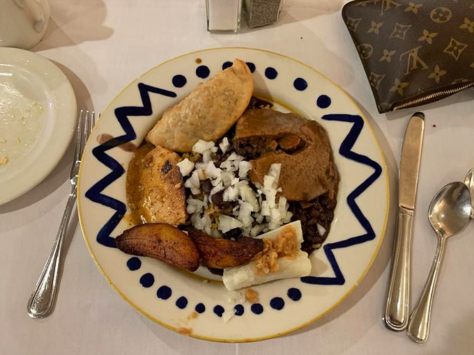 This isn't just a plate of food; it's a cultural dissertation with beans, rice, and plantains that somehow explains Florida's history better than any textbook.