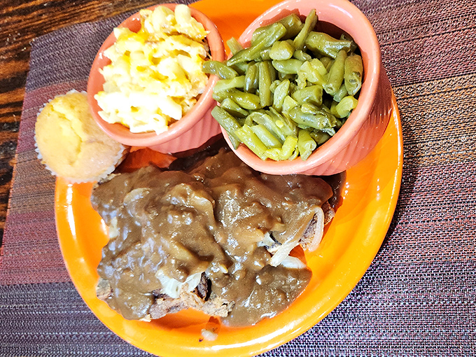 Gravy isn't just a condiment here&mdash;it's practically a spiritual experience. This pork with gravy could make a vegetarian question their life choices.