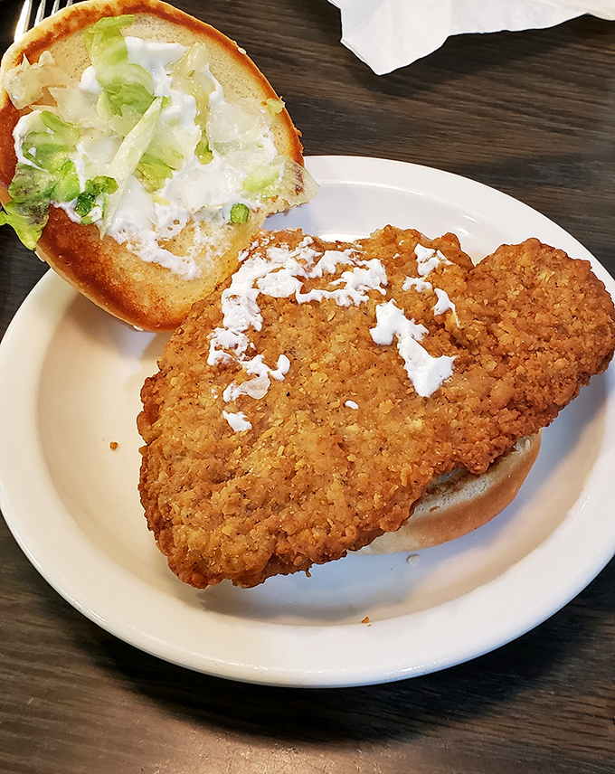 This isn't just a sandwich&mdash;it's a golden-fried monument to the Midwest, where pork tenderloin refuses to be contained by mere bread.