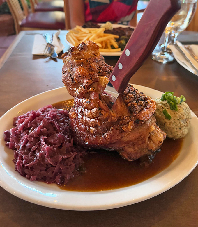That knife isn't just for show. This pork shank has the kind of crackling exterior that makes a satisfying "crack" heard three tables away.