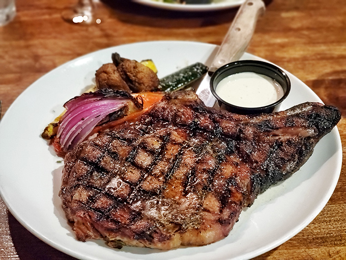 This isn't just a steak; it's a masterclass in meat preparation. Those perfect grill marks aren't just for show&mdash;they're flavor geography you can taste.