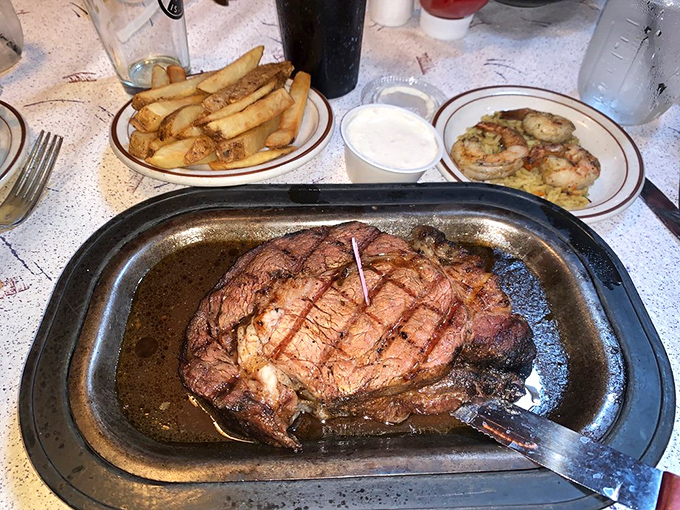Behold the star of the show – prime rib so perfectly cooked it makes you wonder if the chef has some sort of meat telepathy.